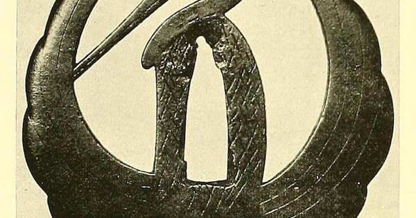 ‘Tsuba made of iron, openwork, shaped like a heraldic crane. Eyes made ...